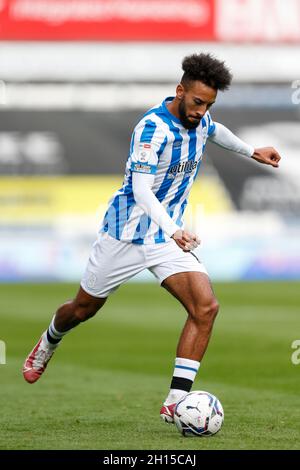 Sorba Thomas #16 of Huddersfield Town in the challenge in, on 9/11/2021 ...