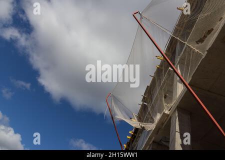 Construction safety net. A construction mesh that prevents objects from ...