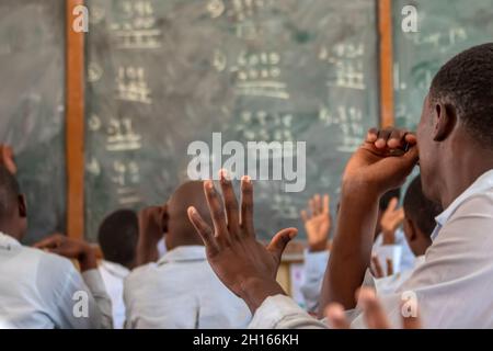A class of South African school children concentrate on laptops during ...
