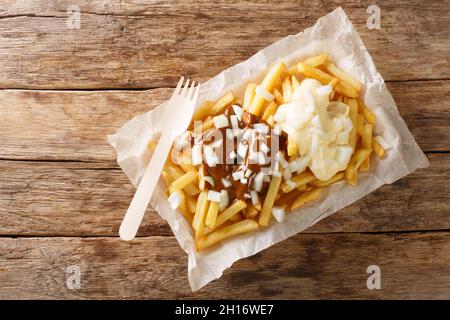 Patatje oorlog is a Dutch street food dish consisting of fries topped ...