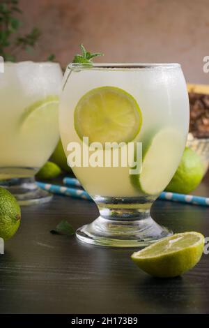 lime pieces and leaves of mint with ice Stock Photo - Alamy