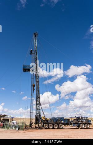 A pulling unit or workover rig on an oil well in Utah. Behind are the ...