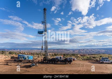 A pulling unit or workover rig on an oil well in Utah. Behind are the ...