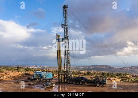 A pulling unit or workover rig on an oil well in Utah. Behind are the ...
