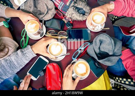 Group of people with devices in hands working together as symbol of ...
