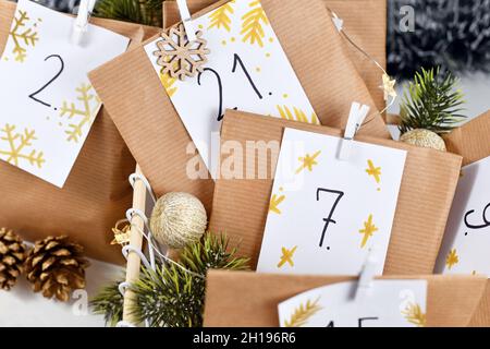 Creative advent calendar made of gift boxes in basket at home, closeup ...