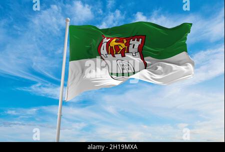 flag of Wolfsburg at cloudy sky background on sunset, panoramic view ...