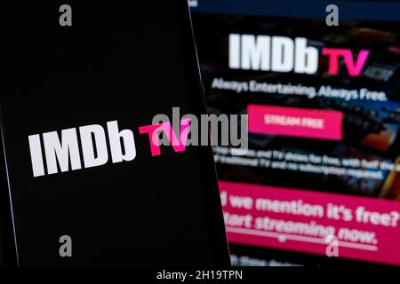 IMDbTV logo seen on smartphone and its streaming platform website on ...