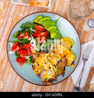 Russian french-style meat on a plate Stock Photo - Alamy