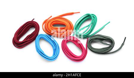 Rolls of different shoe laces on color background Stock Photo - Alamy