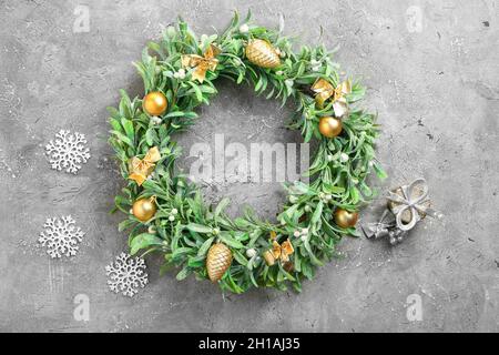 Beautiful mistletoe wreath on grunge background Stock Photo - Alamy