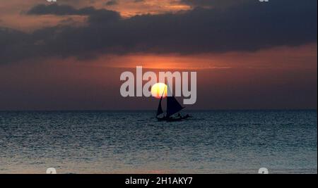 A romantic sunset enjoyed from the beach in Boracay island, Aklan ...