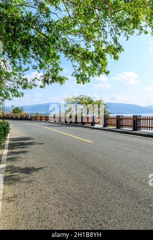 Asphalt highway go aside the bay of ocean Stock Photo - Alamy