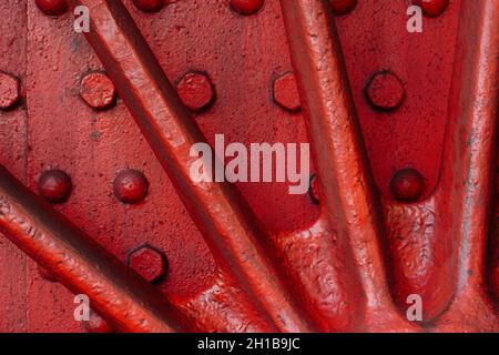Backgrounds and textures: red steam locomotive wheel, close-up shot ...