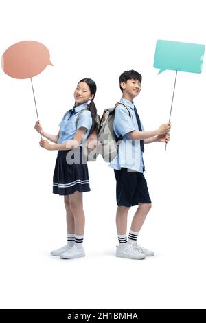 Cheerful students holding speech bubbles Stock Photo - Alamy