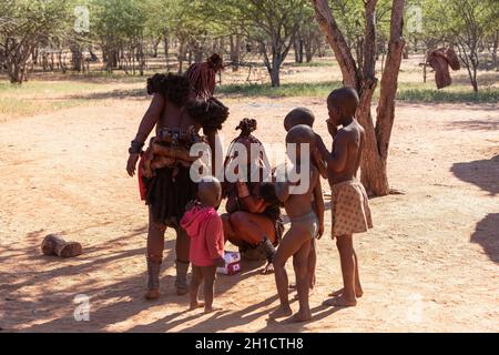 Himba family, in their village in Kamanjab, Namibia, Africa Stock Photo ...