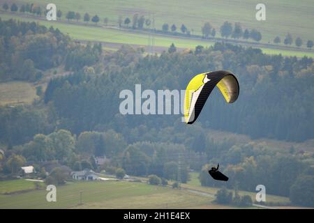 Kozakov, Czech Republic. 18th Oct, 2021. A paraglider flight over the ...