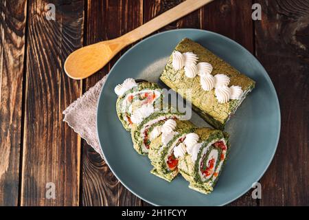Chopped roll with spinach and red fish on square plate Stock Photo - Alamy
