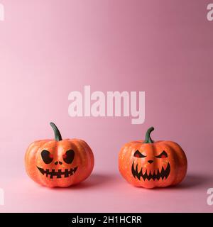 Halloween minimal concept with pink pumpkin, skull and cocktails ...