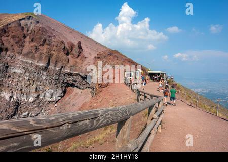 MOUNT VESUVIUS, ITALY - AUGUST 1, 2018: Tourists walk around the crater ...