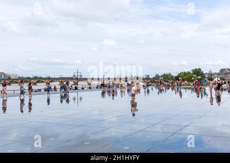 The Famous Bordeaux water mirror full of people having fun in the water ...