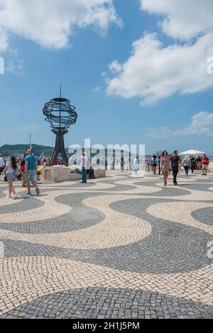 Lisbon, Portugal - May 27, 2018: People walking along the Tagus River ...