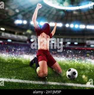 Successful soccer player wins the football match Stock Photo - Alamy