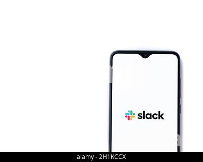 Slack mobile app login screen is seen on a smartphone. Slack is a B2B ...