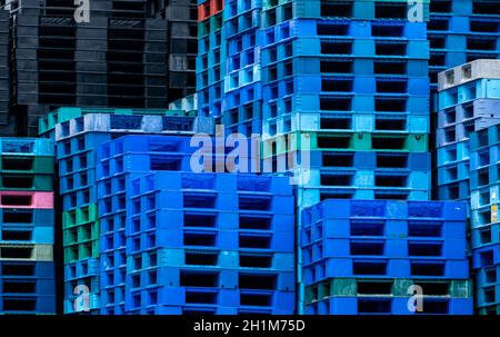 Pile of plastic shipping pallet. Industrial plastic pallet stacked at ...