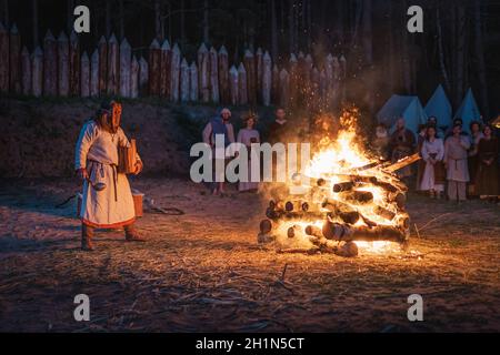 Wooden pagan mask at the Slavic festival Maslenitsa Stock Photo - Alamy