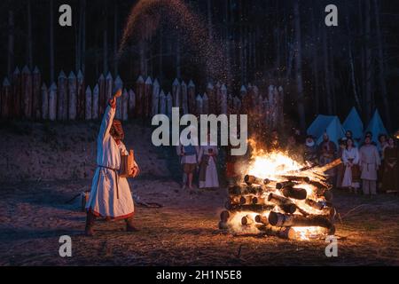 Wooden pagan mask at the Slavic festival Maslenitsa Stock Photo - Alamy