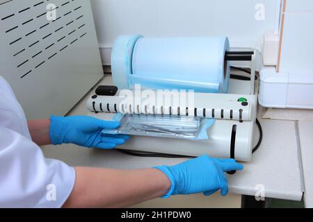 Top view unrecognizable doctors in uniform drinking coffee during break ...