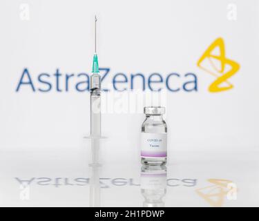AstraZeneca Oxford vaccine concept. Syringe on a white screen and ...