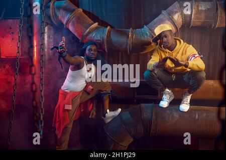 Serious rappers, break-dance performing in studio Stock Photo - Alamy