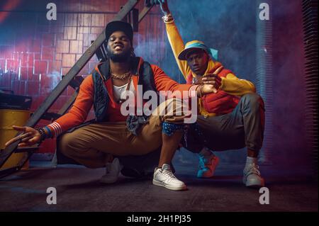 Two serious rappers, breakdancing in studio with cool underground ...