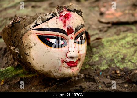 Face of Debi Durga Maa idol in Hinduism in riverbank of Ganges river ...