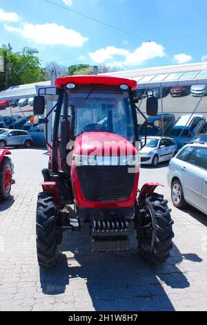 The colorful red tractors. The agriculture, farming concept Stock Photo ...