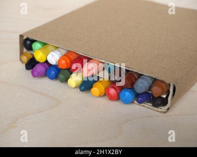 colour pencil crayons in a cardboard box Stock Photo - Alamy