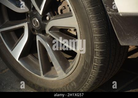 Rear side view front wheel of black car Stock Photo - Alamy