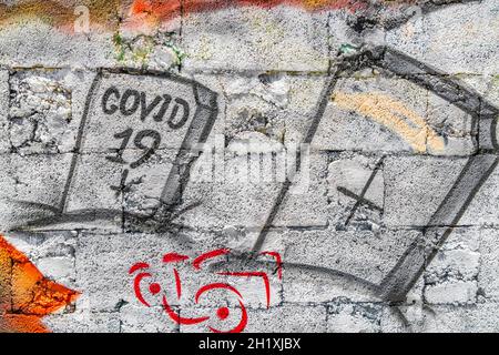 Artistic walls with COVID-19 gravestone cemetery paintings and graffiti ...