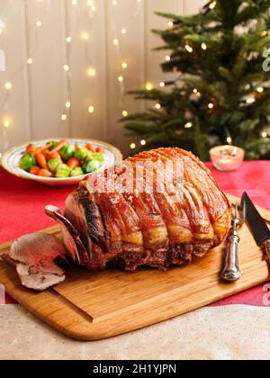 Baked sliced pork leg knuckle. Dark wooden background. Top view Stock ...