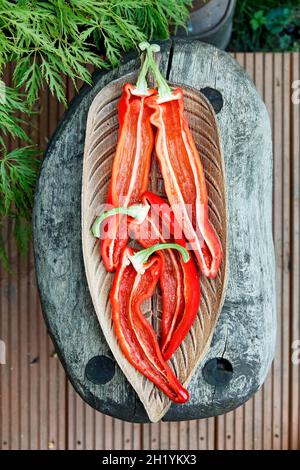 Sliced red pointed peppers, studio photography with black background ...