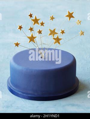A blue party cake with star decorations Stock Photo - Alamy