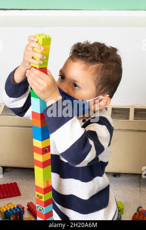 Preschool boy stacking blocks Stock Photo - Alamy