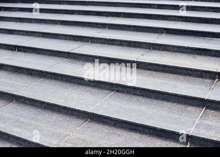 Large staircase with stone-like grey texture, wide granite ladder ...
