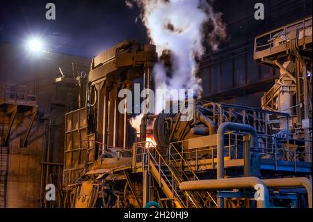 Electric arc steelmaking furnace, thick powerful red-hot graphite ...