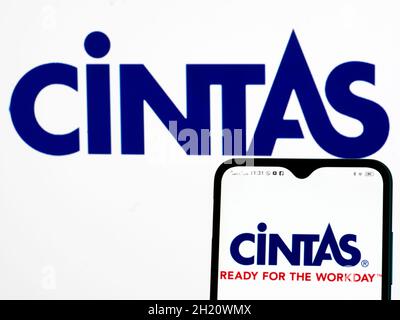In this photo illustration a Cintas Corporation logo is seen on a ...