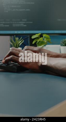 African american person programming codes for firewall server on ...