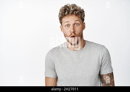 Man looking amazed while checking promo on smartphone, looking ...