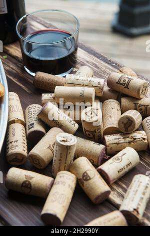 Wine bottle surrounded by corks Stock Photo - Alamy